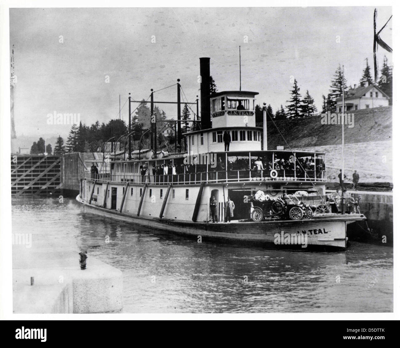 This photograph shows the sternwheeler J.N. Teal navigating the ...
