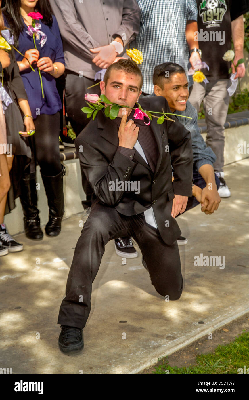 well dressed student clowns with a rose given on graduation day at a ...