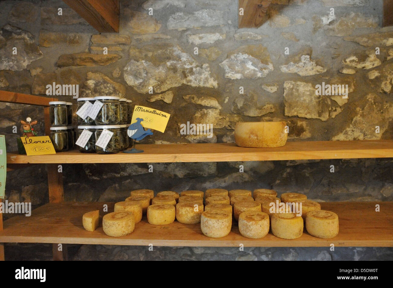 Cheese shelf in a store Stock Photo - Alamy