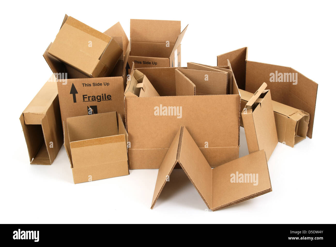 Pile of used cardboard boxes on white background Stock Photo - Alamy