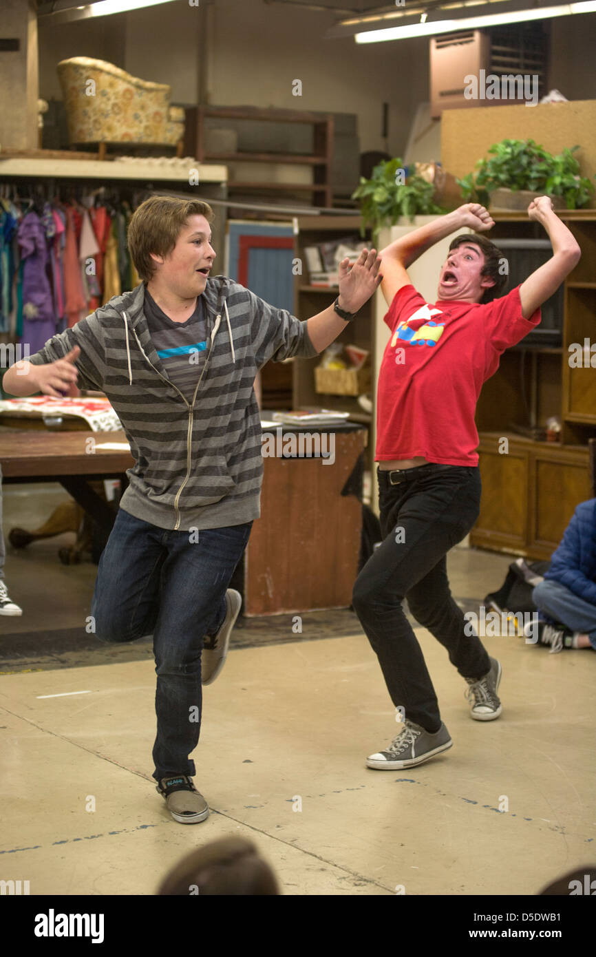 Two high school drama drama students perform improvisational theatre ...