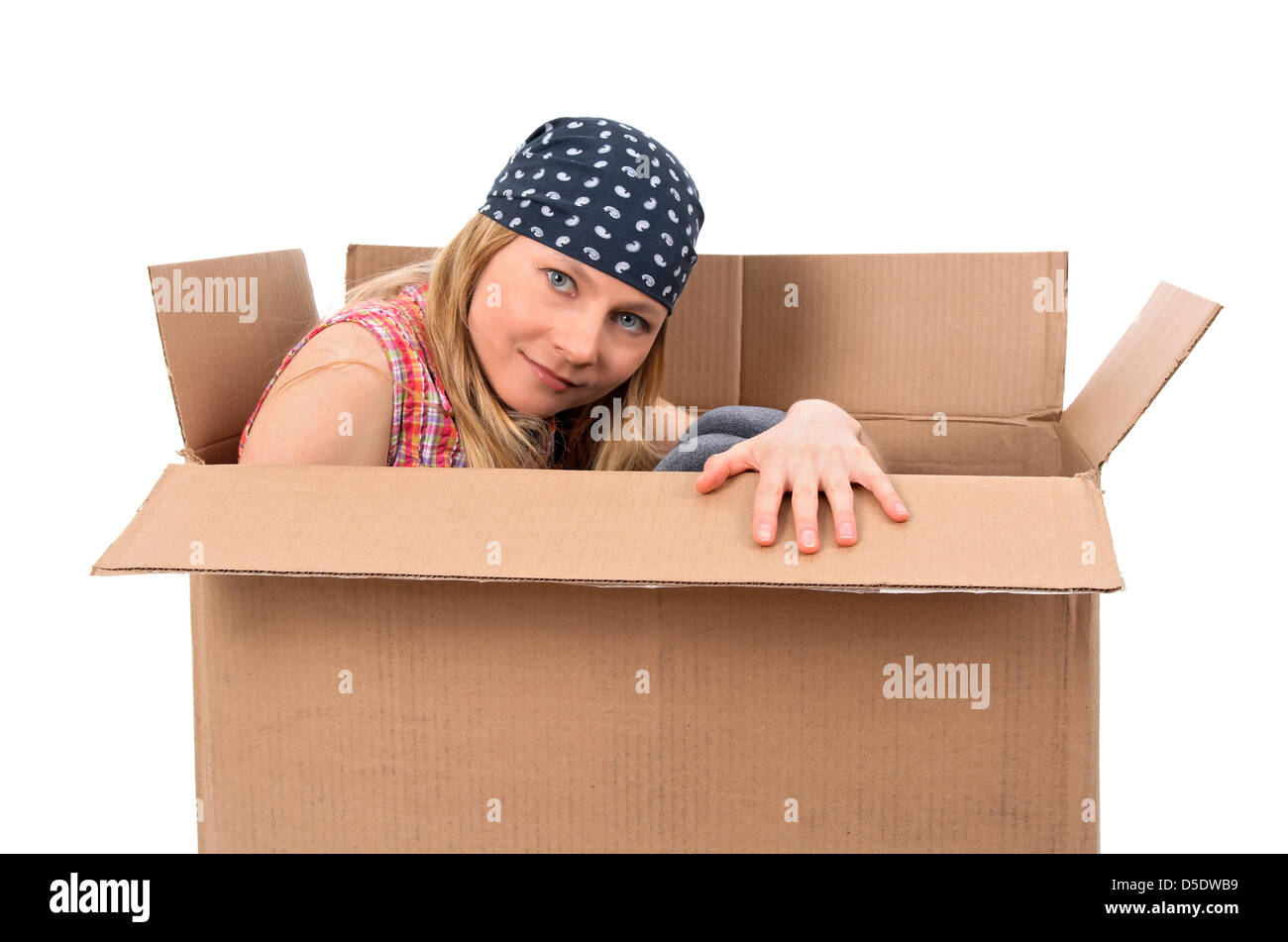 Girl hiding in a cardboard box. Isolated on white Stock Photo - Alamy