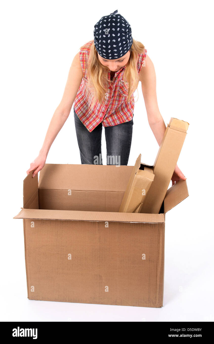 Young woman checking the contents of a cardboard box Stock Photo - Alamy