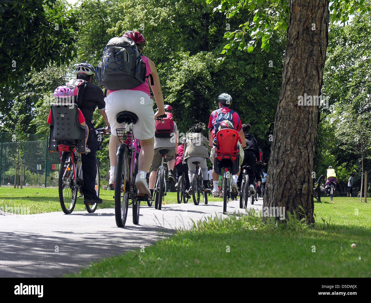 Group of cyclists in the park Stock Photo - Alamy