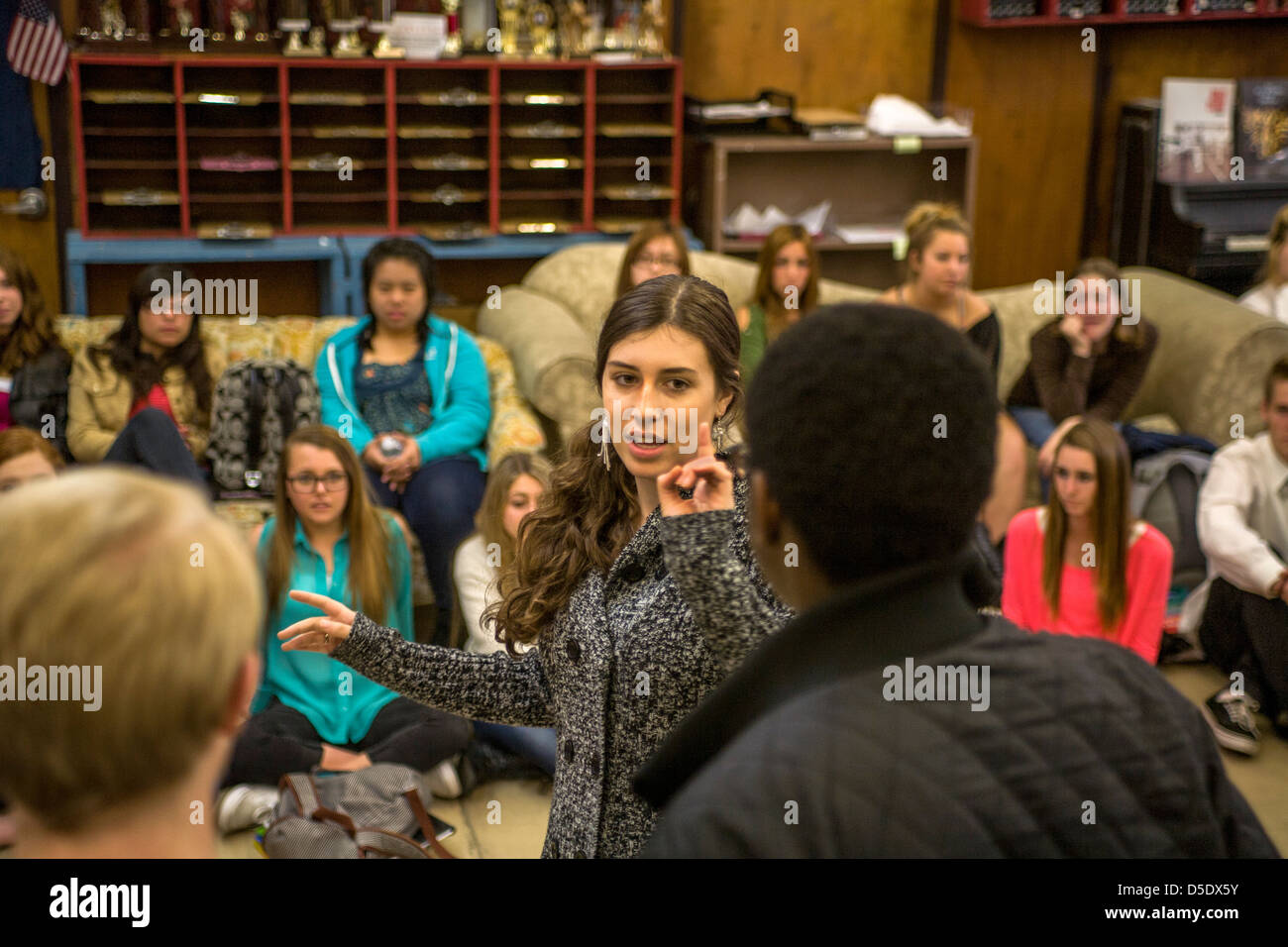 As their multiethnic classmates watch, high school drama drama students ...