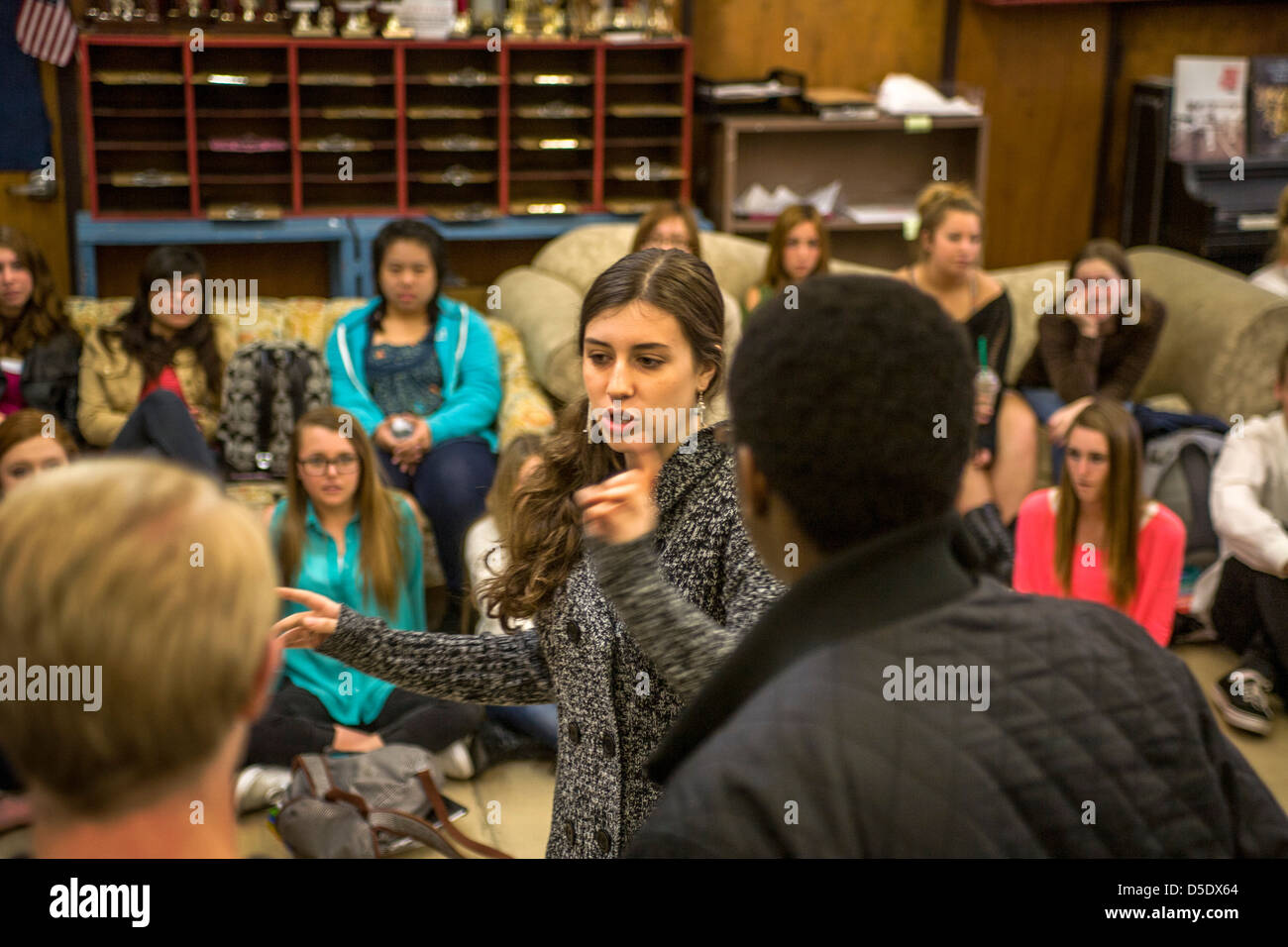 As their multiethnic classmates watch, high school drama drama students ...