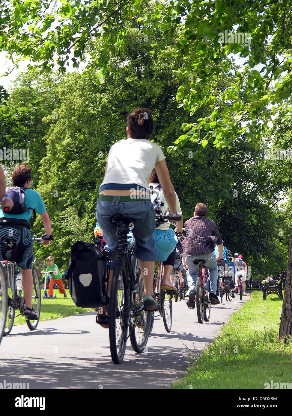 Group of cyclists in the park Stock Photo - Alamy