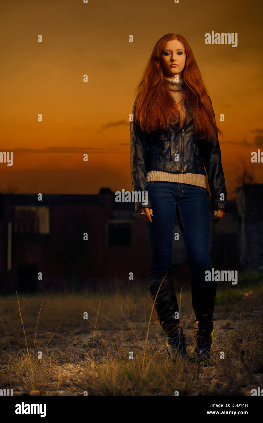 Woman leather jacker outside building Stock Photo - Alamy