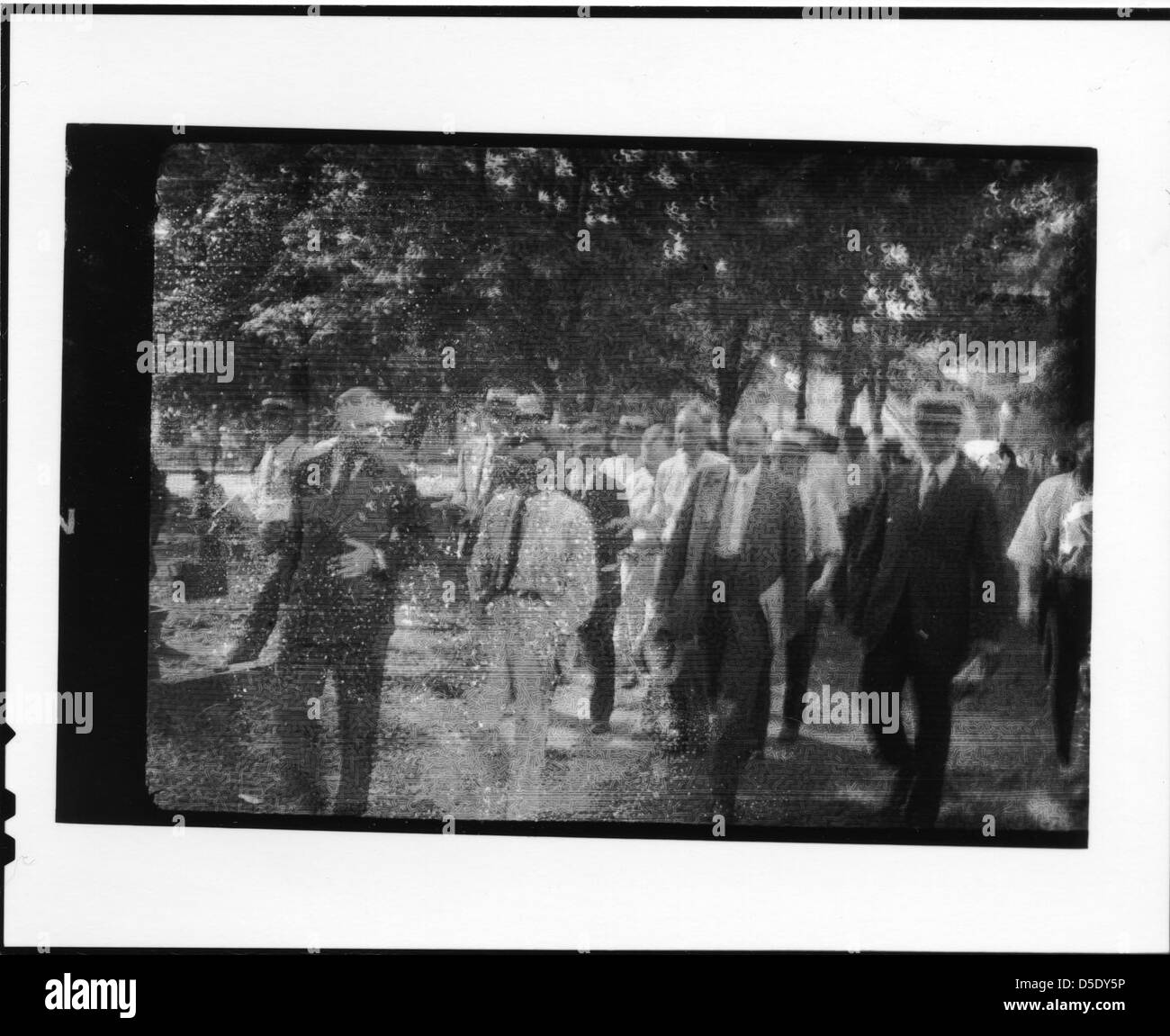 A photograph of a group of men walking during the Scopes Trial in ...