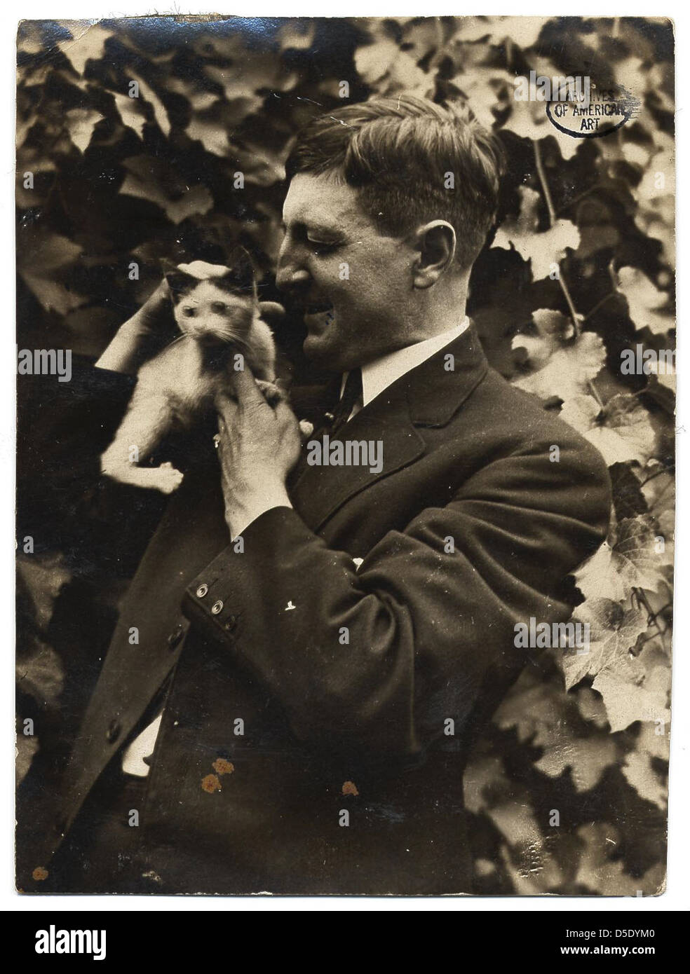 A photograph of Alfred Lenz, a photographer, captured with a cat in a ...