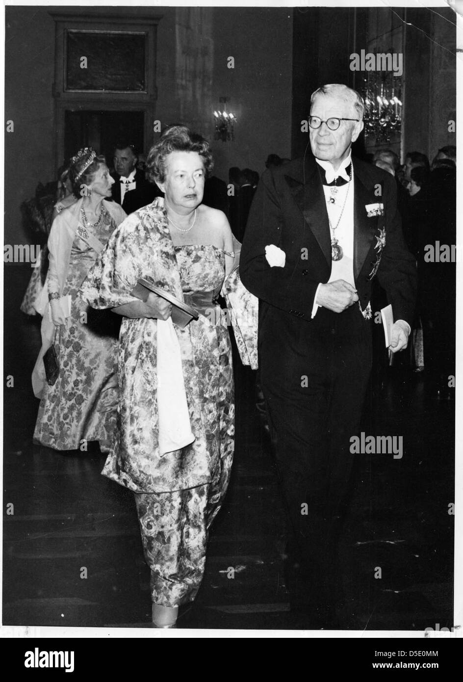 A photograph of Maria Goeppert-Mayer walking into the Nobel Prize ...