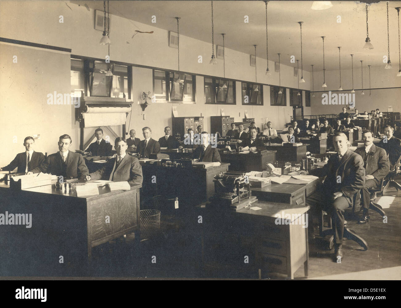 A photograph showing postal employees working at the Postal Savings ...