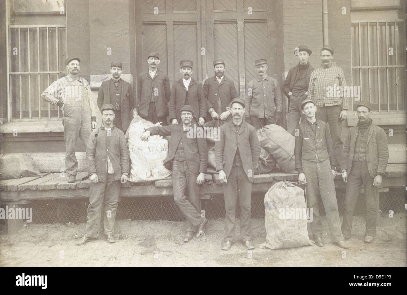 A historical photograph showing Railway Mail Service clerks in Kansas ...