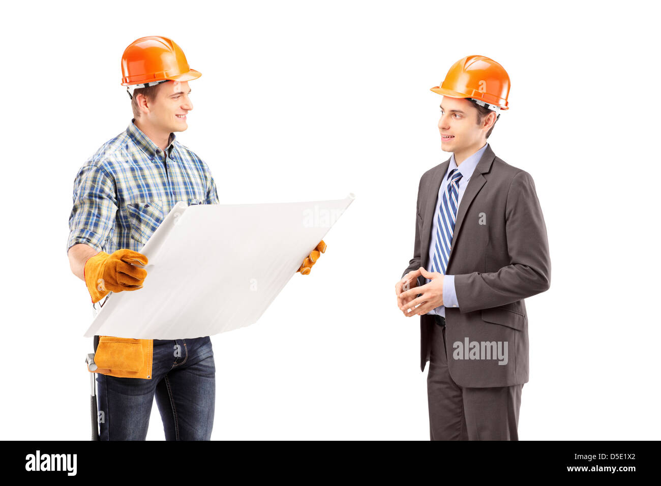 Male engineer holding a blueprint and having a conversation with ...