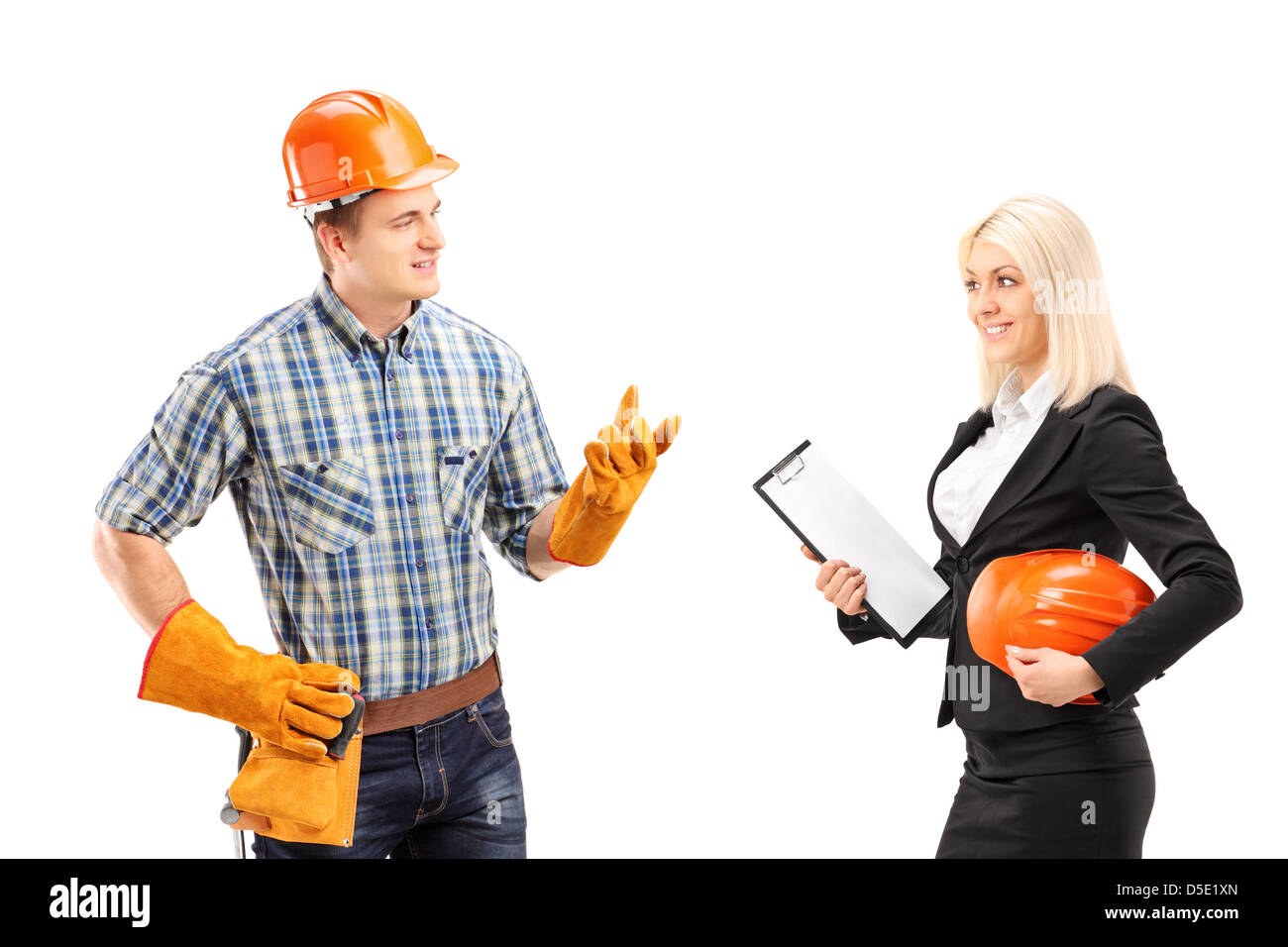 Male manual worker having a conversation with female architect ...