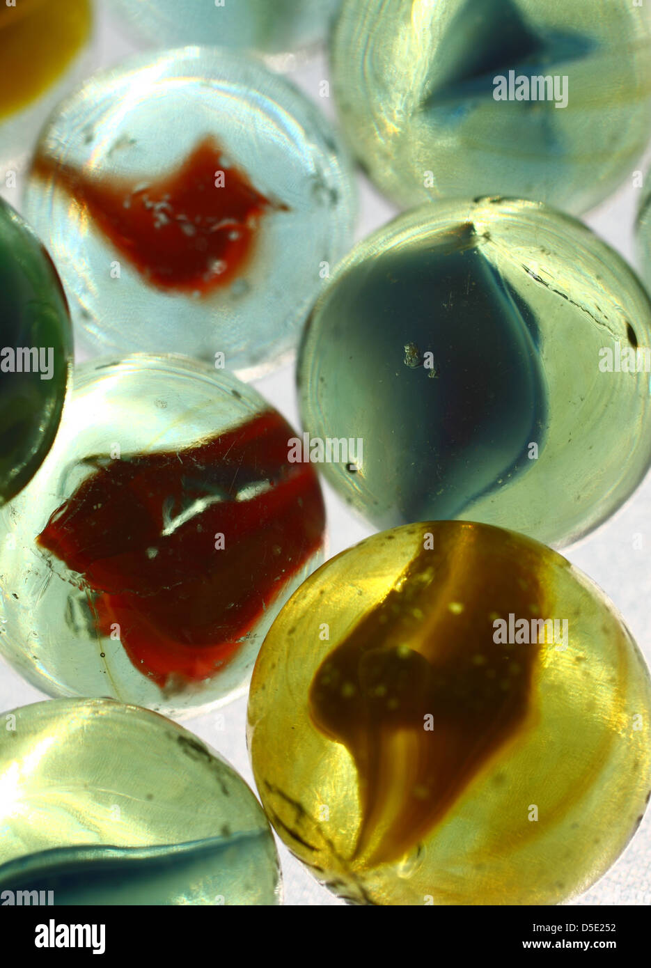 Colourful marbles on a white background Stock Photo - Alamy