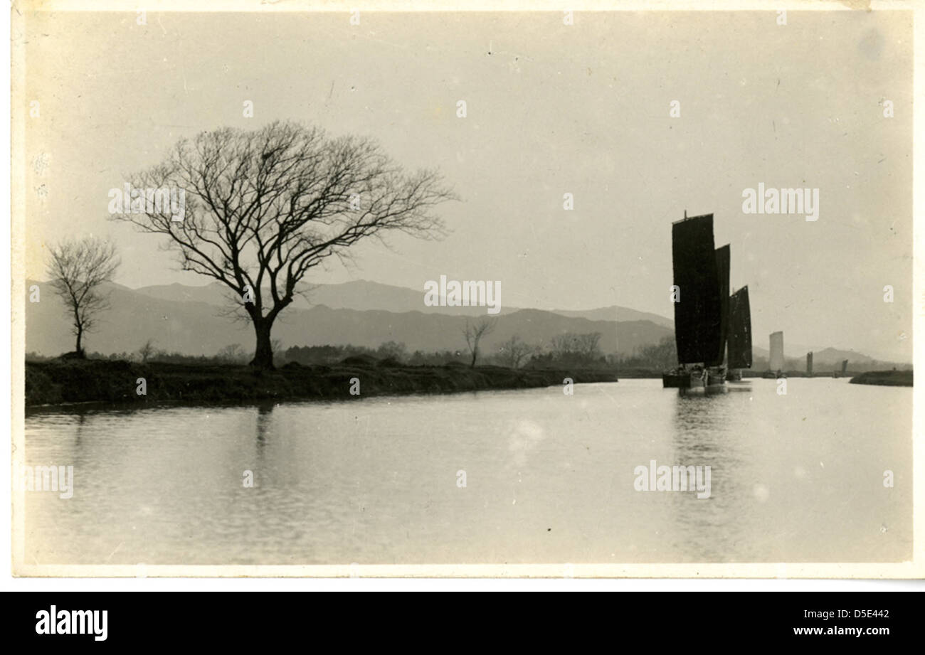 A scenic view of a hill and creek near Soochow, China, with traditional ...