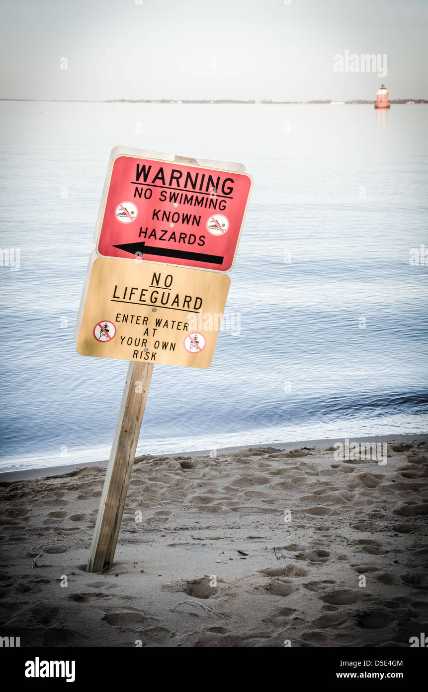 Warning Signs on the beach at Sandy Point State Park, with the Shoal ...