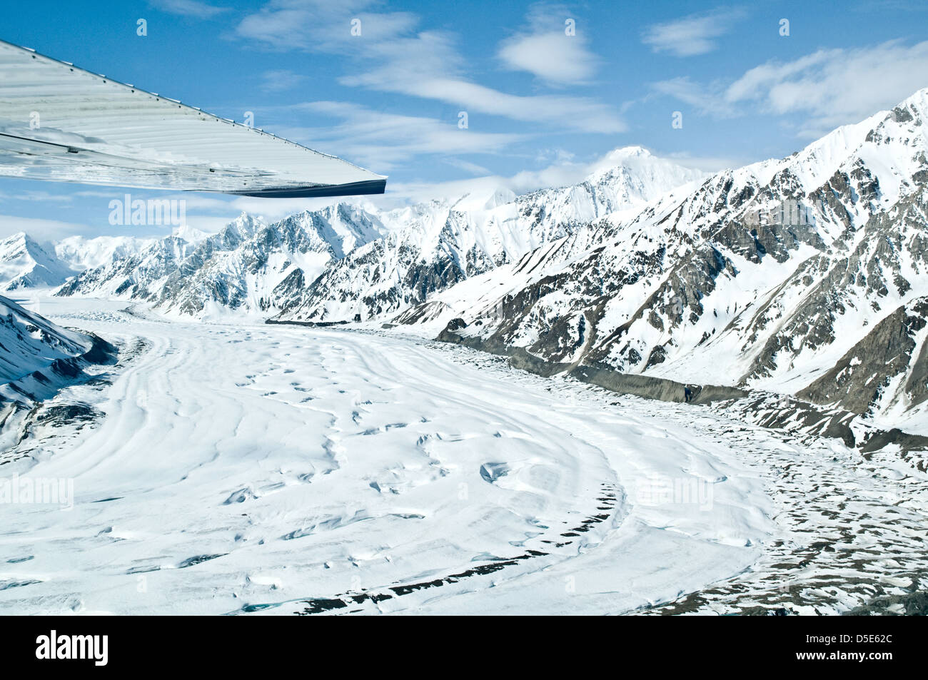 An aerial view of a glacier and ice fields during a glacier viewing ...