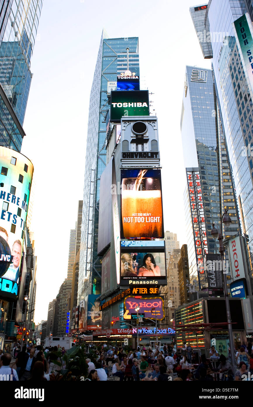 The tall buildings and adverts in Times Square in New York City with ...