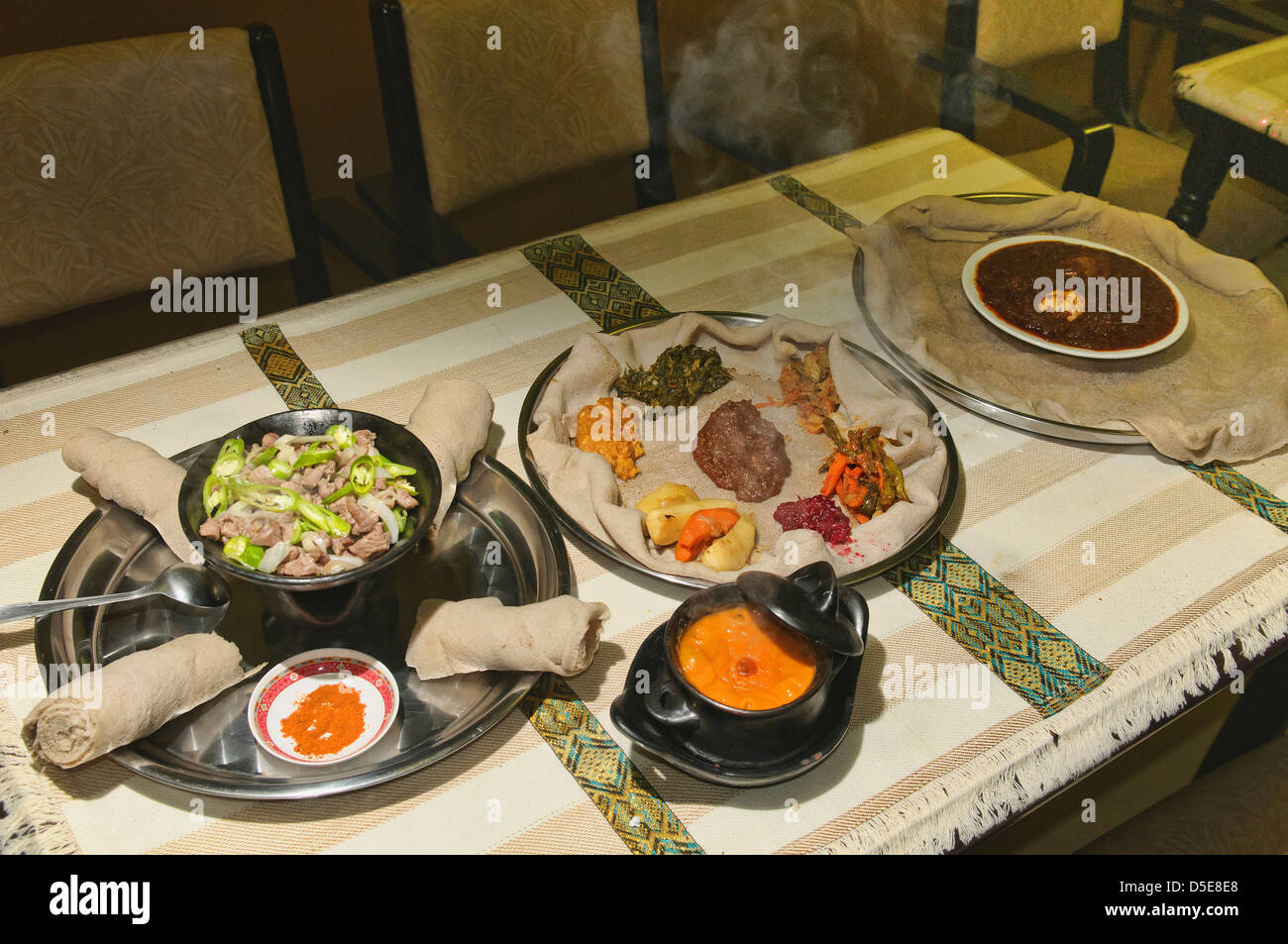 traditional Ethiopian cuisine, doro wat, injera, and curry Stock Photo ...