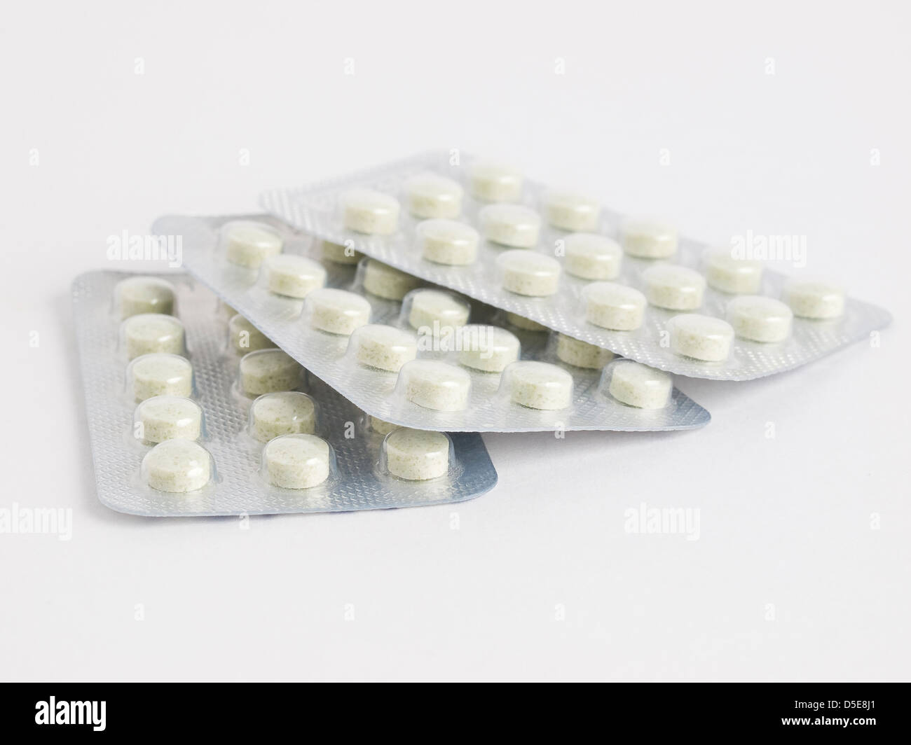 Three pills tablets on white backgrond Stock Photo - Alamy