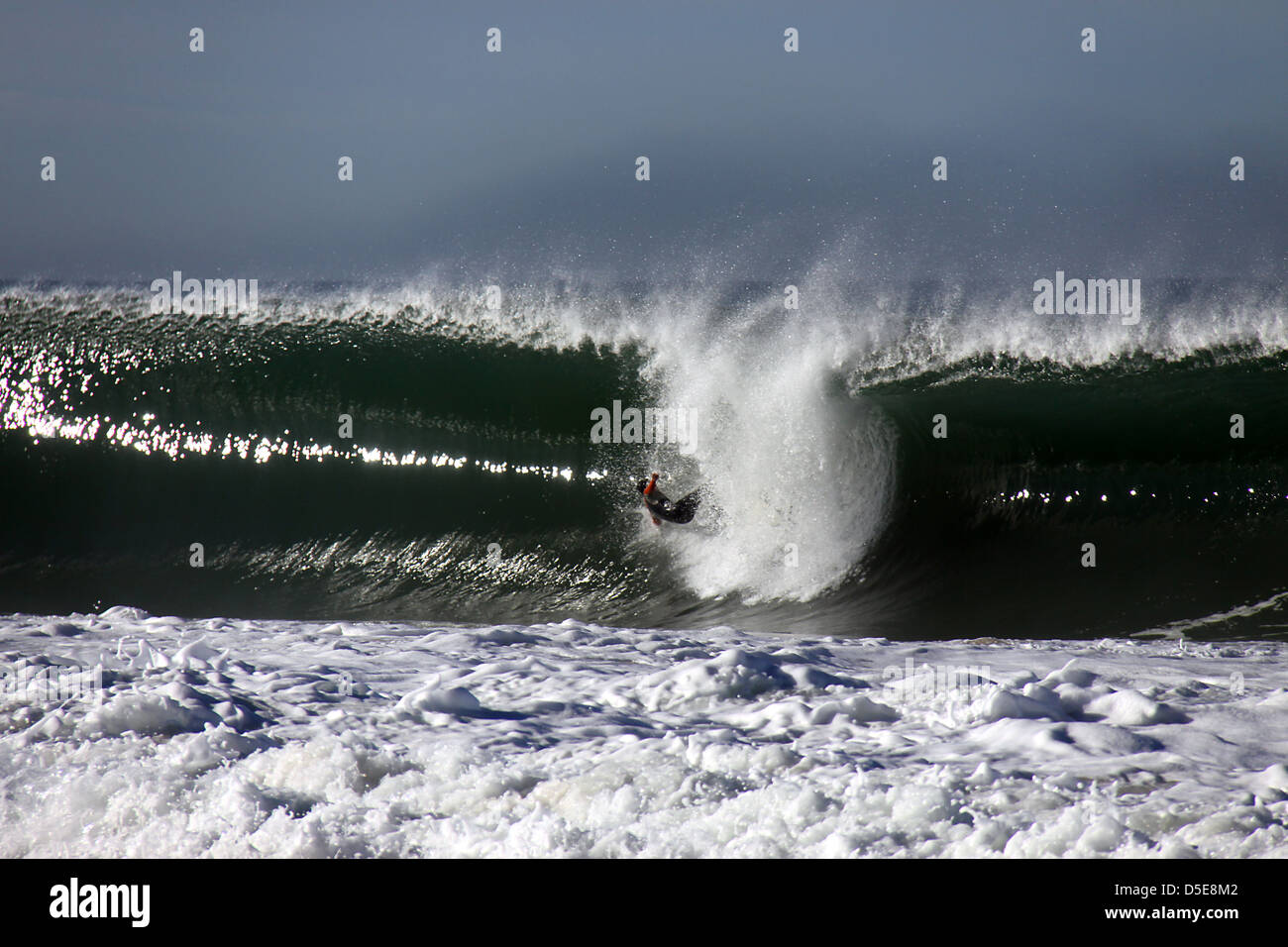Surfer falling off board in south-west France Stock Photo - Alamy