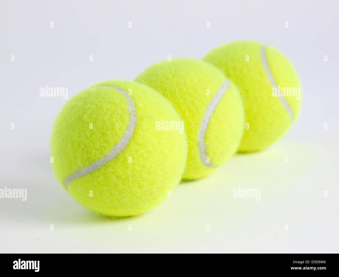 Three paddle balls in a row isolated on grey background Stock Photo - Alamy