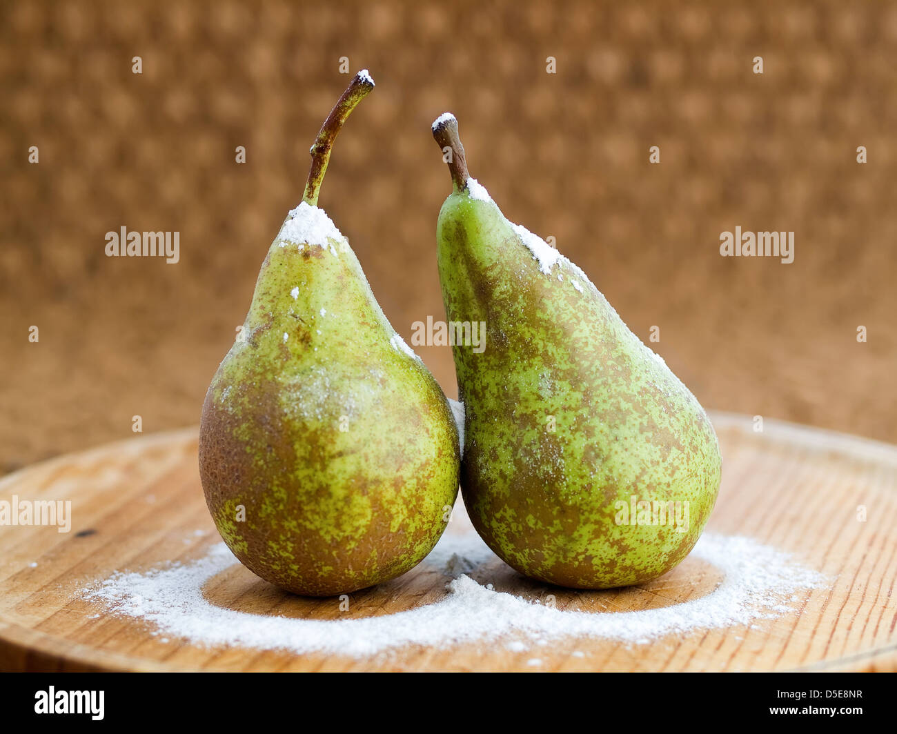 Two pears with flour. Flour tries to imitate snow Stock Photo - Alamy