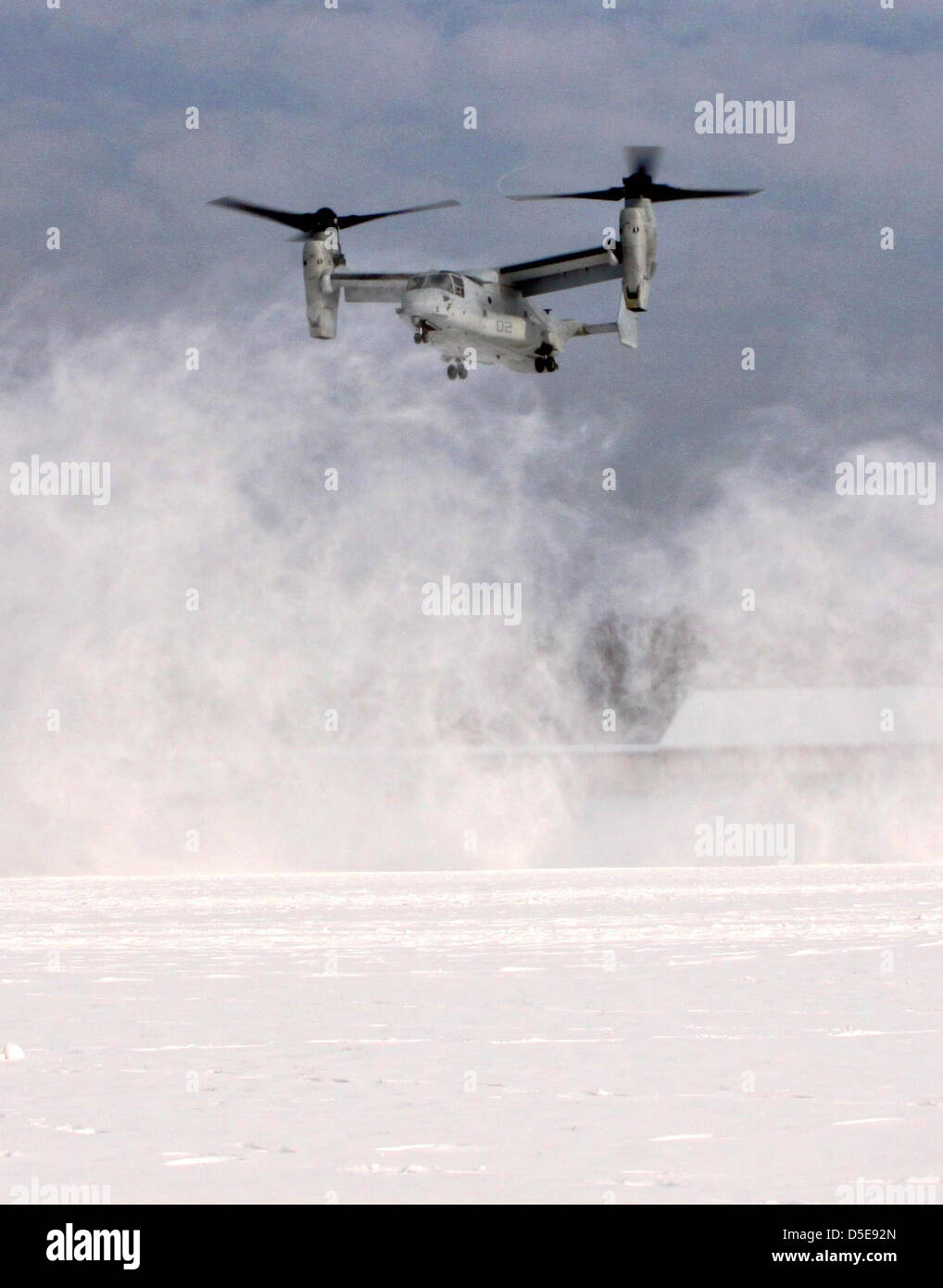US Marine Corps MV-22B Osprey blows snow everywhere as it prepares to ...