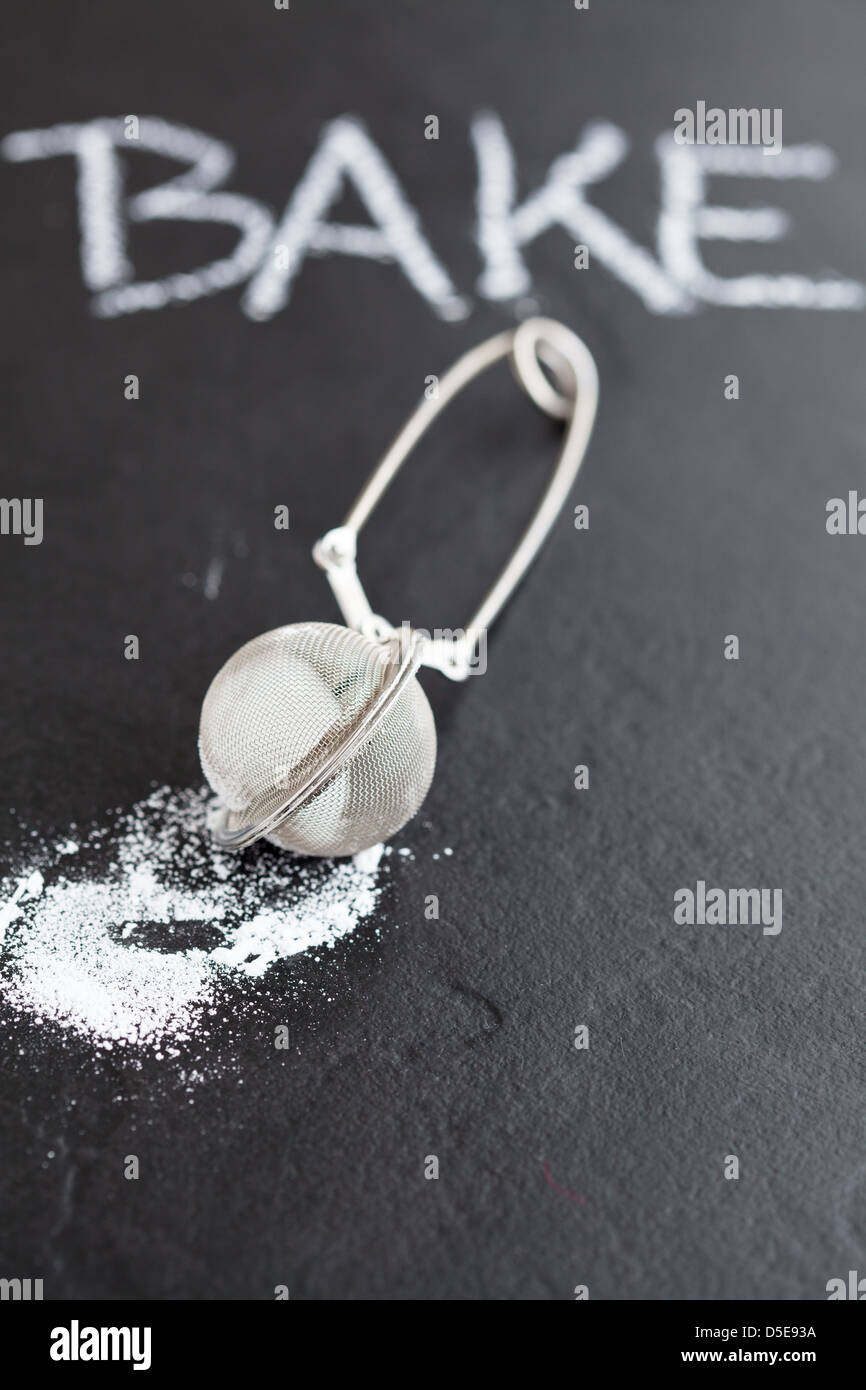Sieve on white background with sugar hi-res stock photography and ...