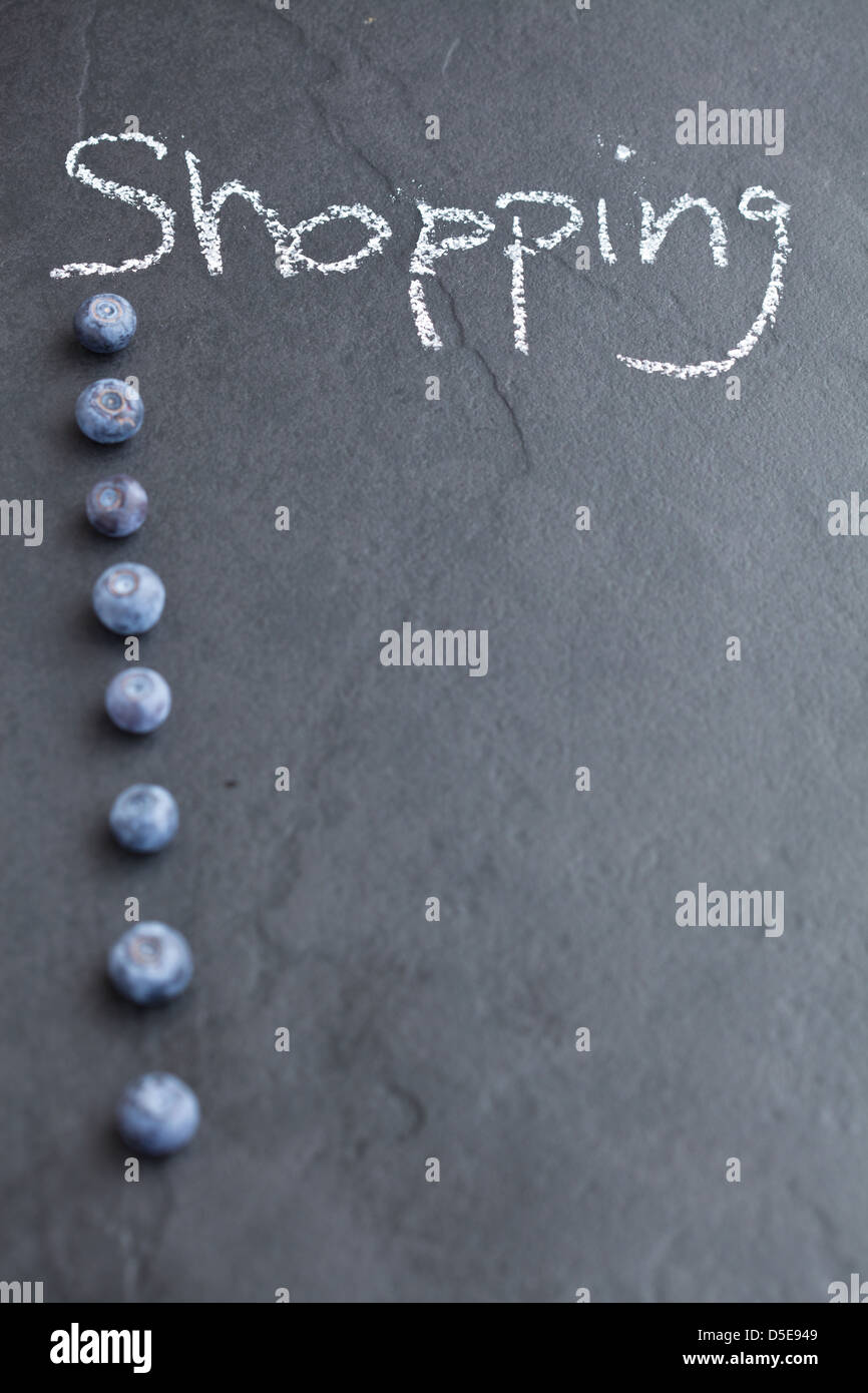Closeup of shopping list background created from blueberries and word ...