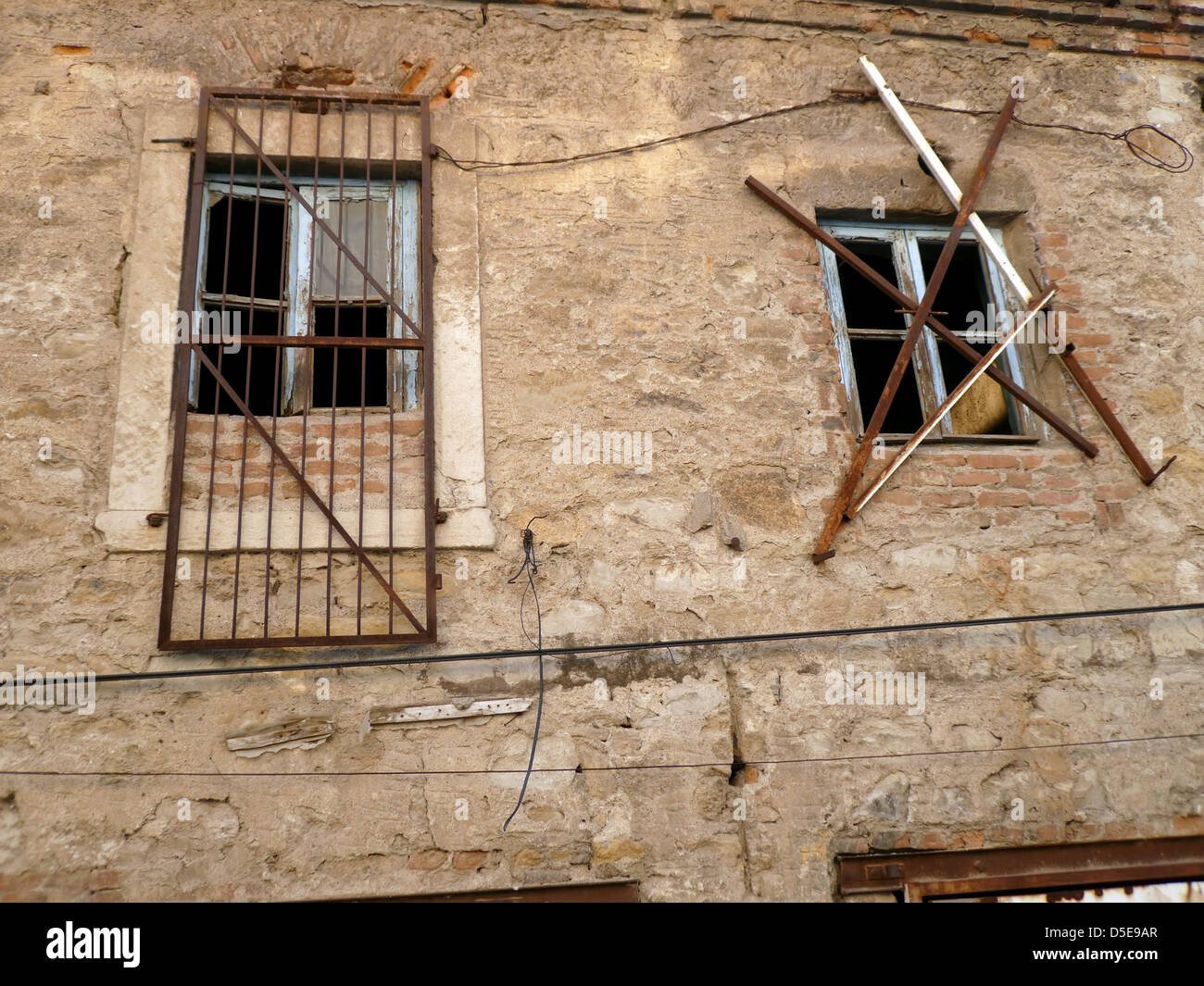 Broken windows of an old building Stock Photo - Alamy