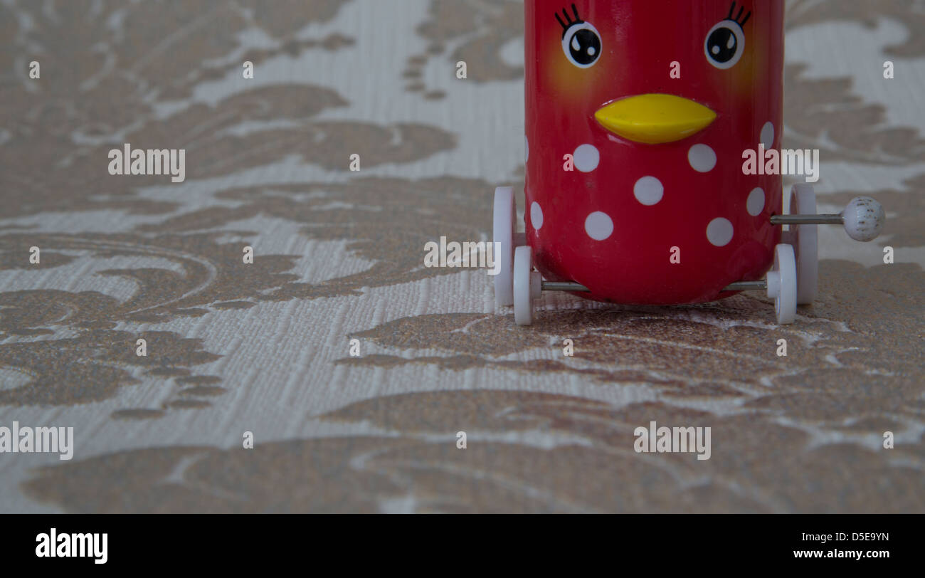 A photograph of a rolling toy pepper shaker in the form of a colorful ...