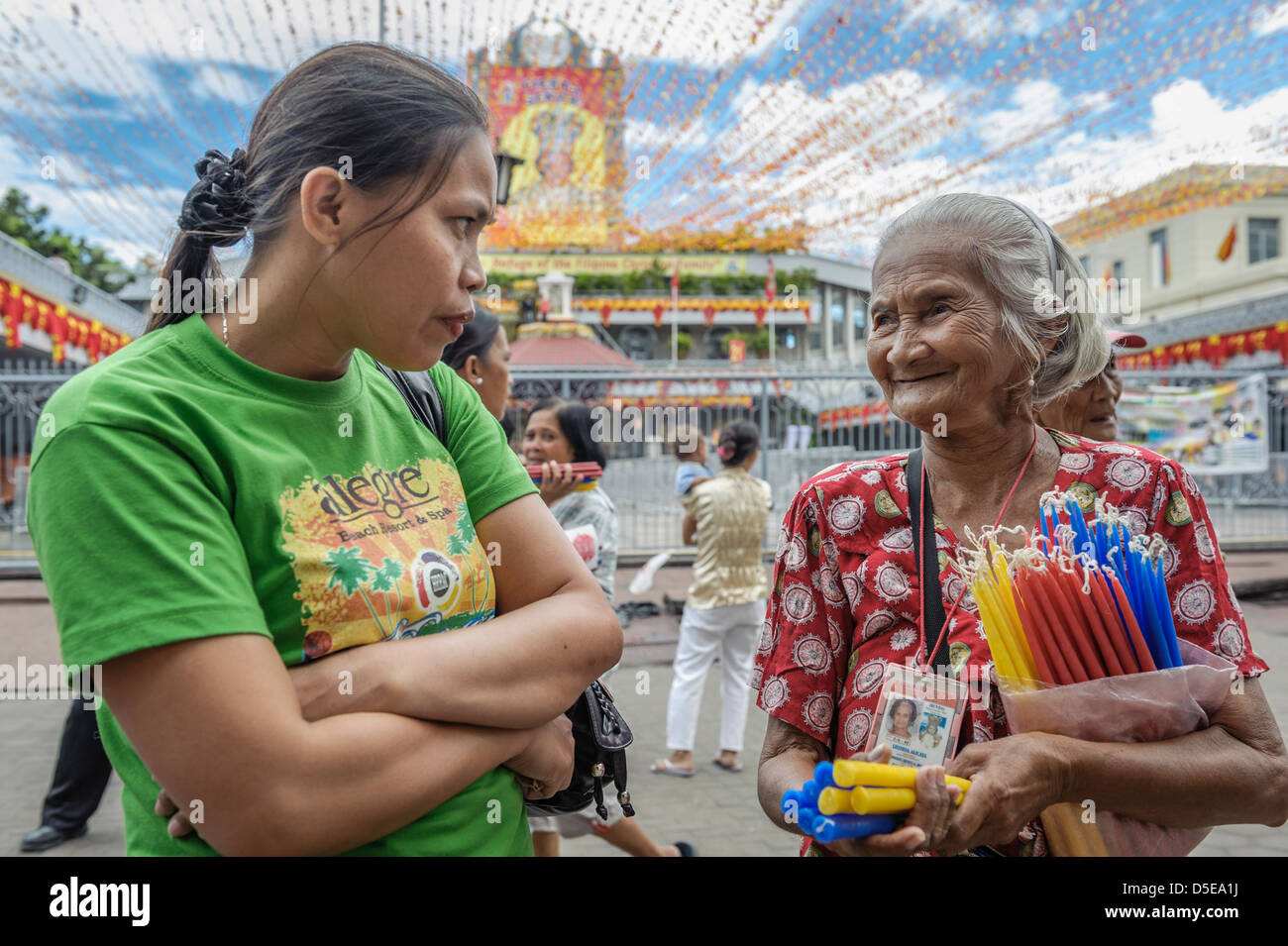 People praying in front of The Basilica Minore del Santo Niño, Cebu ...