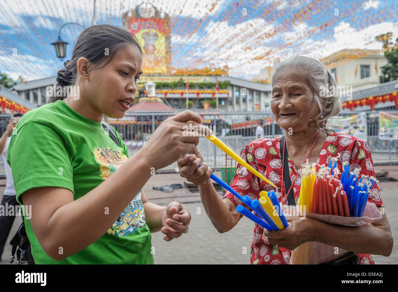 People praying in front of The Basilica Minore del Santo Niño, Cebu ...