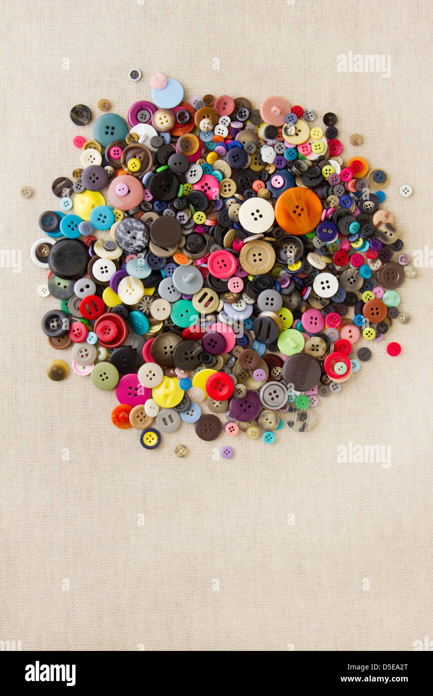Pile of mixed buttons, dark and bright, on hessian Stock Photo - Alamy