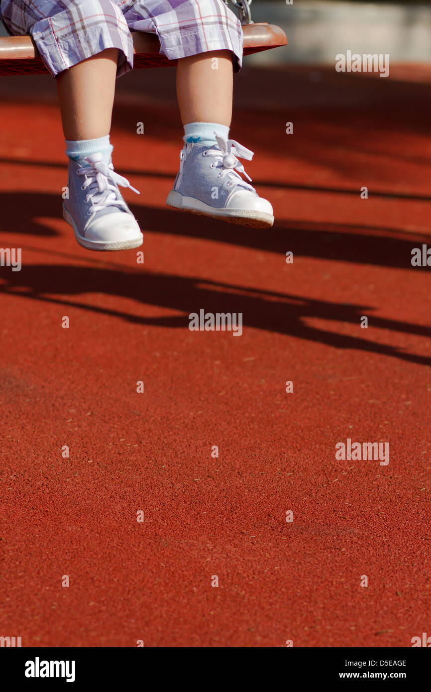 Child swinging legs hi-res stock photography and images - Alamy