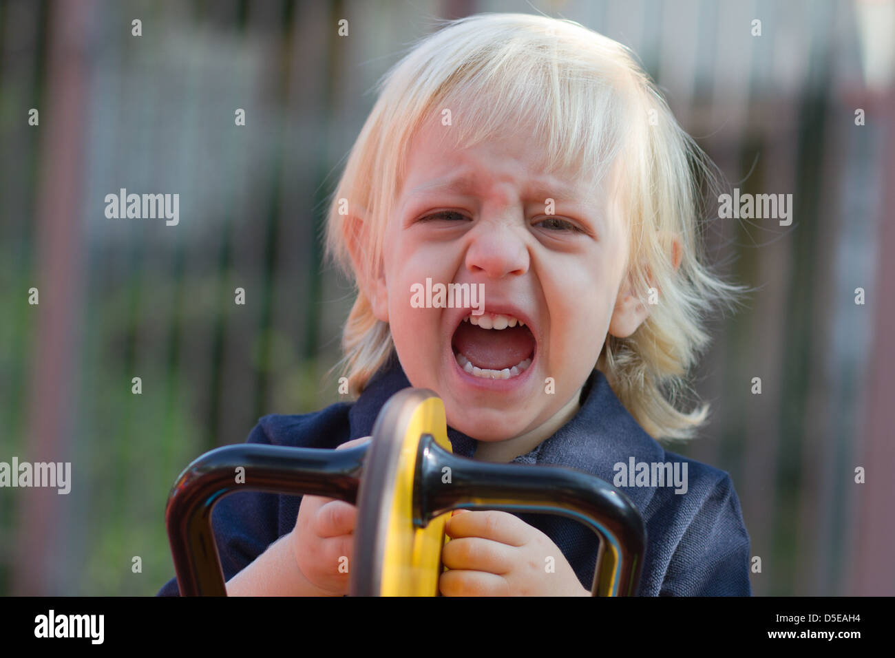 Little baby boy crying out loud alone on the playground Stock Photo - Alamy