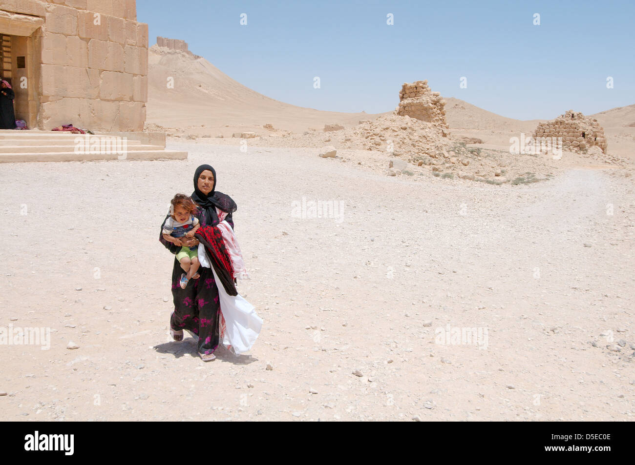 Bedouin with the girl in his arms near Tower Valley of Tombs Palmyra ...
