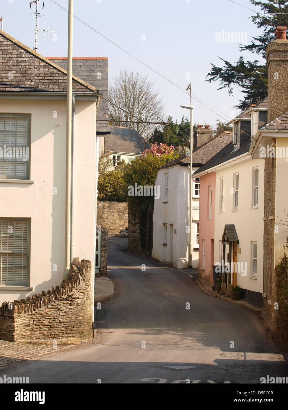 Narrow street through Devon village Stock Photo - Alamy