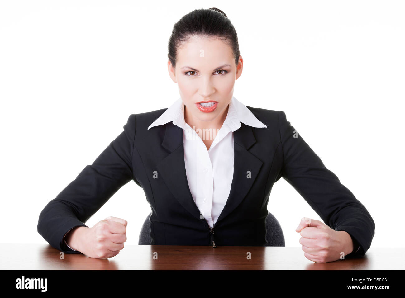 Angry businesswoman at the desk, isolated on white background Stock ...