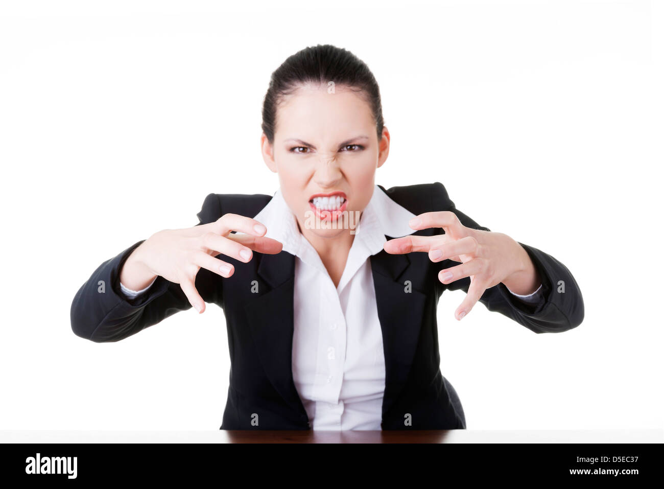 Angry businesswoman at the desk, isolated on white background Stock ...