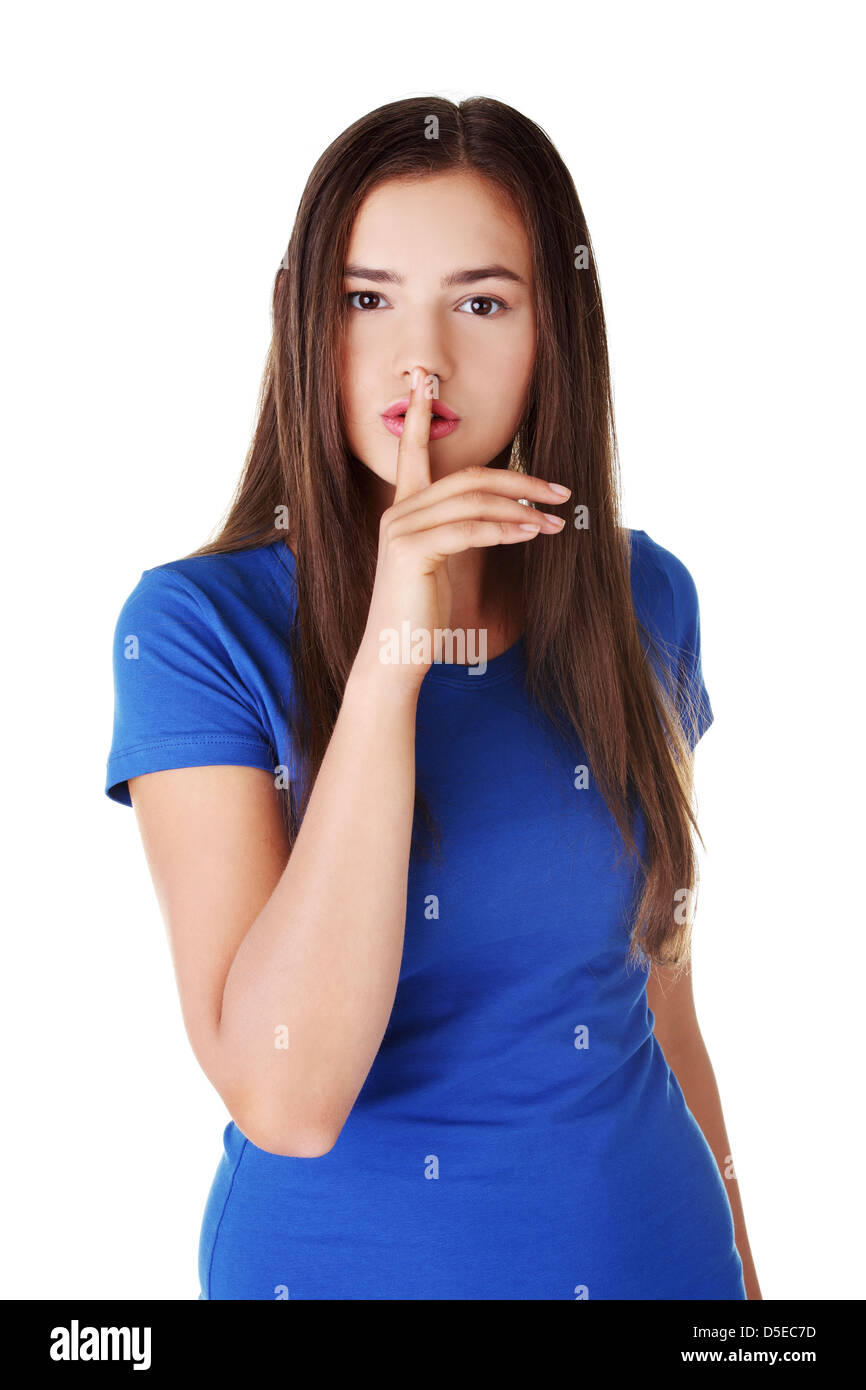 Hush be quiet woman isolated. Teen girl with finger on her lips Stock ...