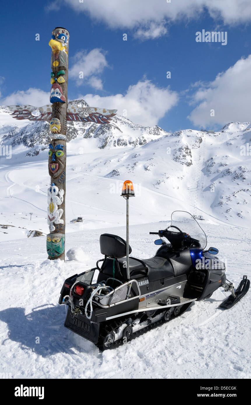 Snowmobile and totem pole in the Italian Alps Stock Photo - Alamy