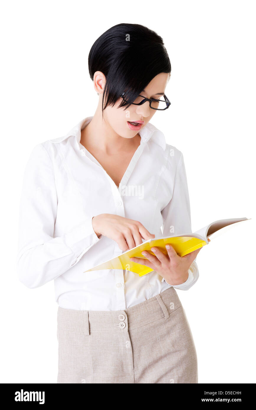 Young focused female reading book, isolated on white Stock Photo - Alamy