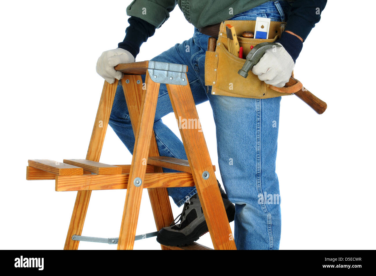 Closeup of a construction worker climbing a ladder with a hammer in his ...