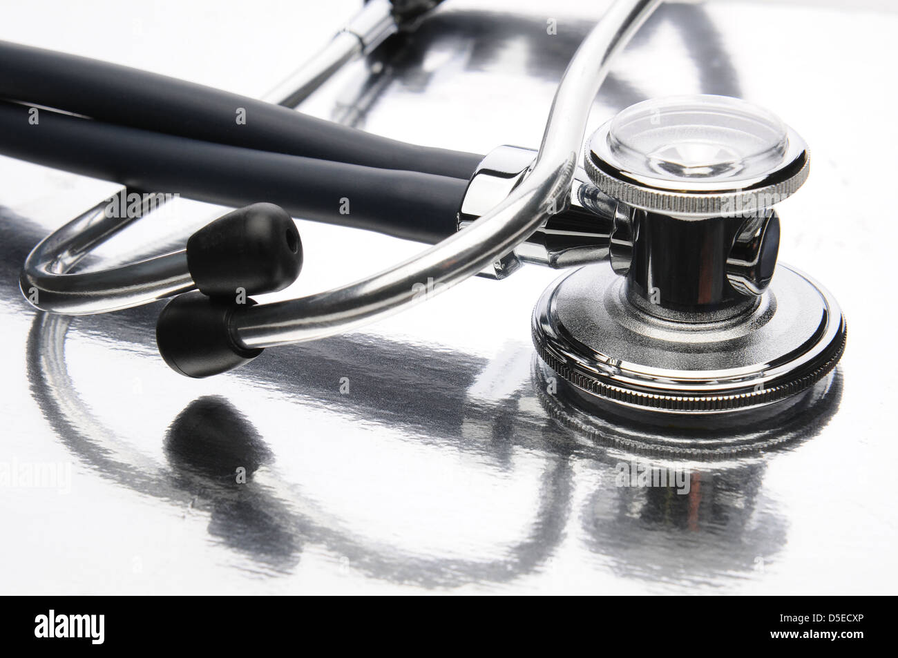 Closeup of a Stethoscope on a reflective surface. Horizontal format ...