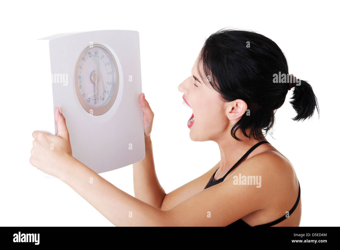 Frustrated woman with scale, isolated on white Stock Photo - Alamy