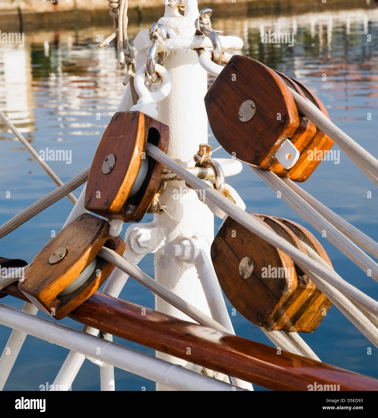 Four wooden snatch block. Detail of a big tall ship Stock Photo - Alamy